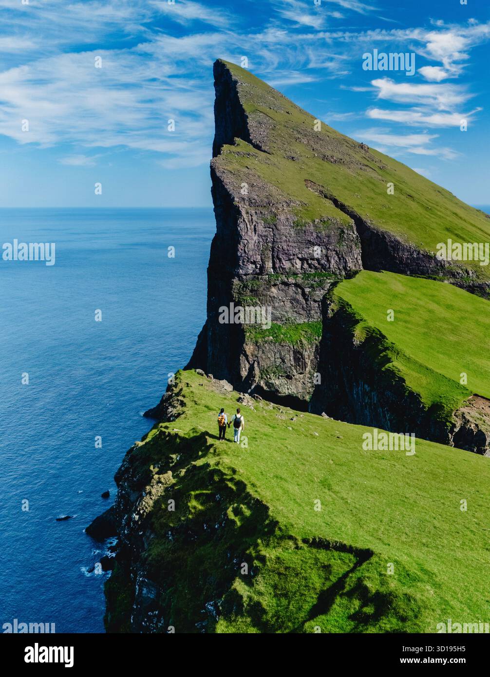 A couple of men and women on the hiking trail of Mylingur cliff, the ...
