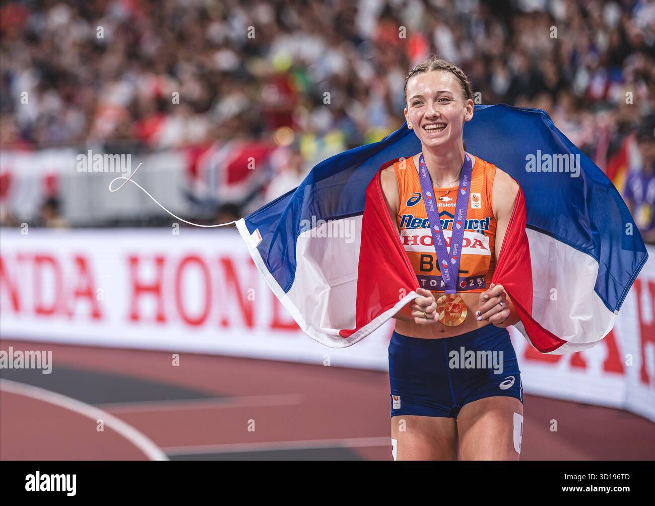 Femke Bol celebrating her medal with her country's flag at the 2025 ...