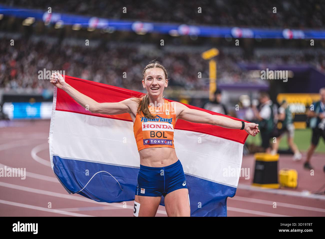 Femke Bol celebrating her medal with her country's flag at the 2025 ...