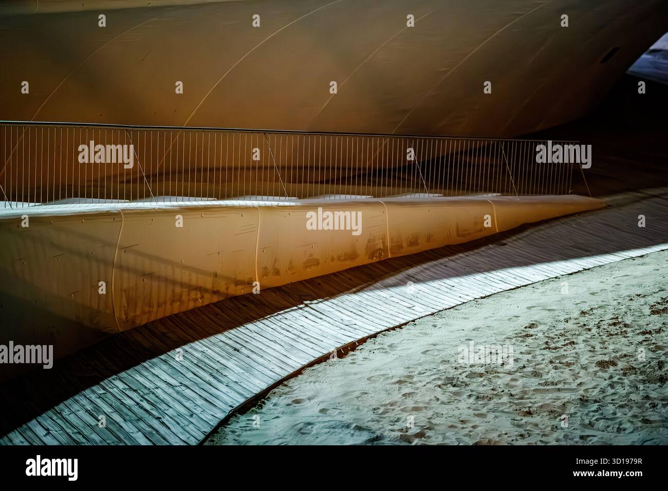 Warm Glow Beneath the Promenade's Curved Underbelly Stock Photo - Alamy
