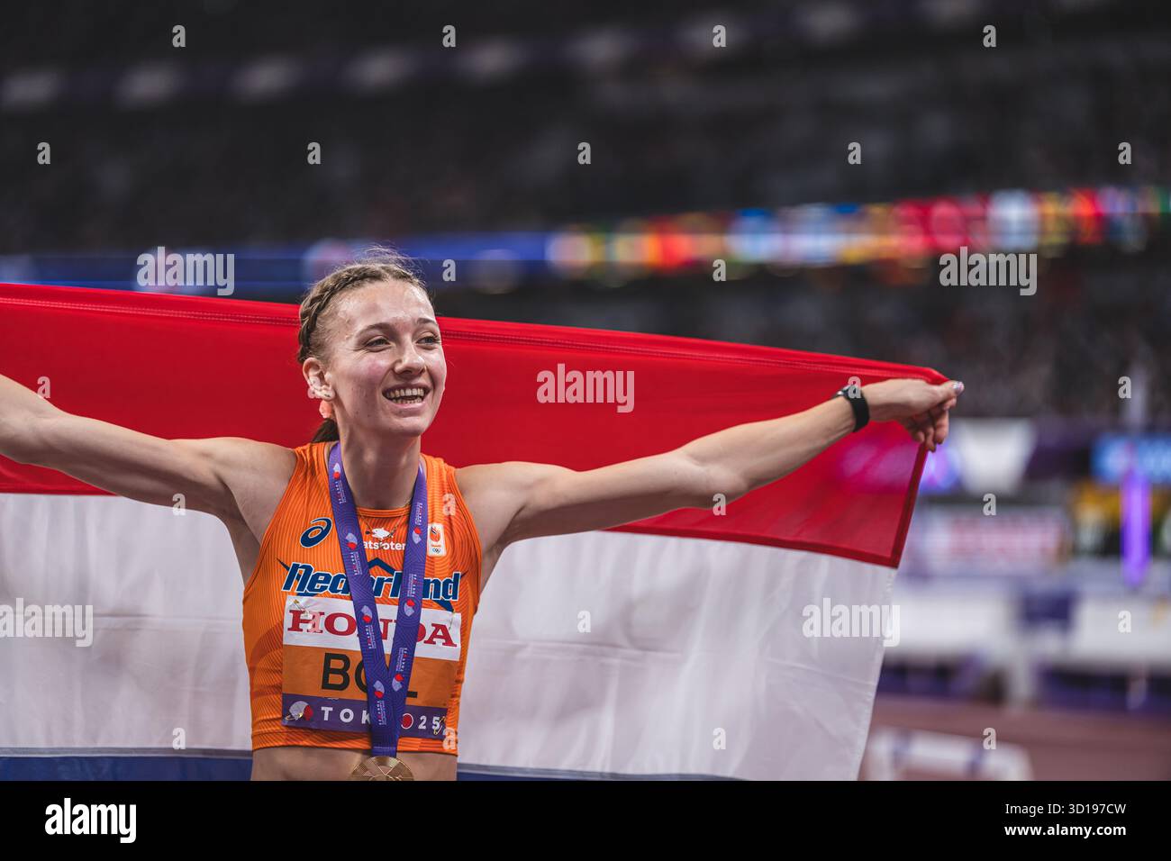 Femke Bol celebrating her medal with her country's flag at the 2025 ...