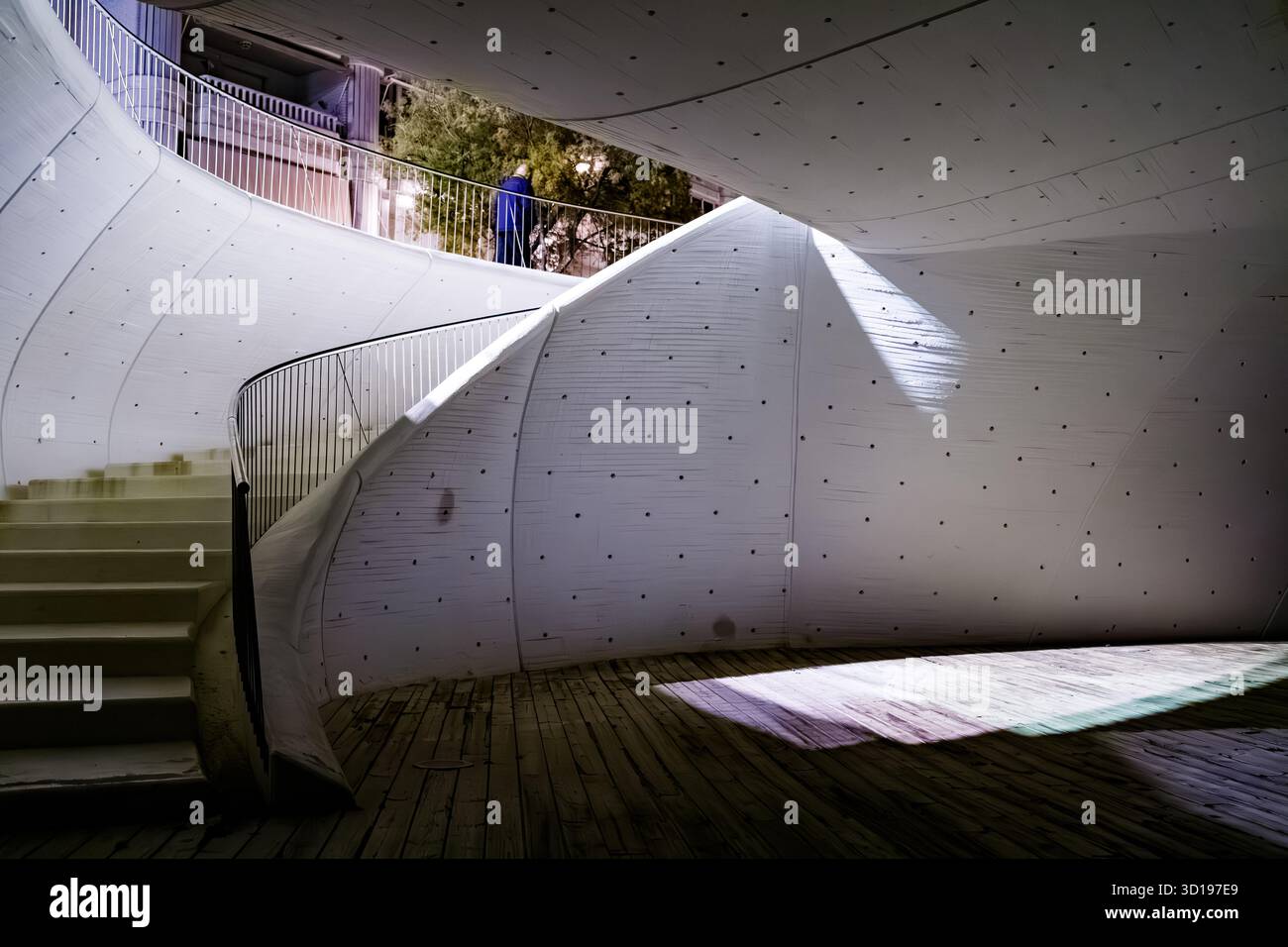 Figure on the Curved Architectural Walkway Stock Photo - Alamy