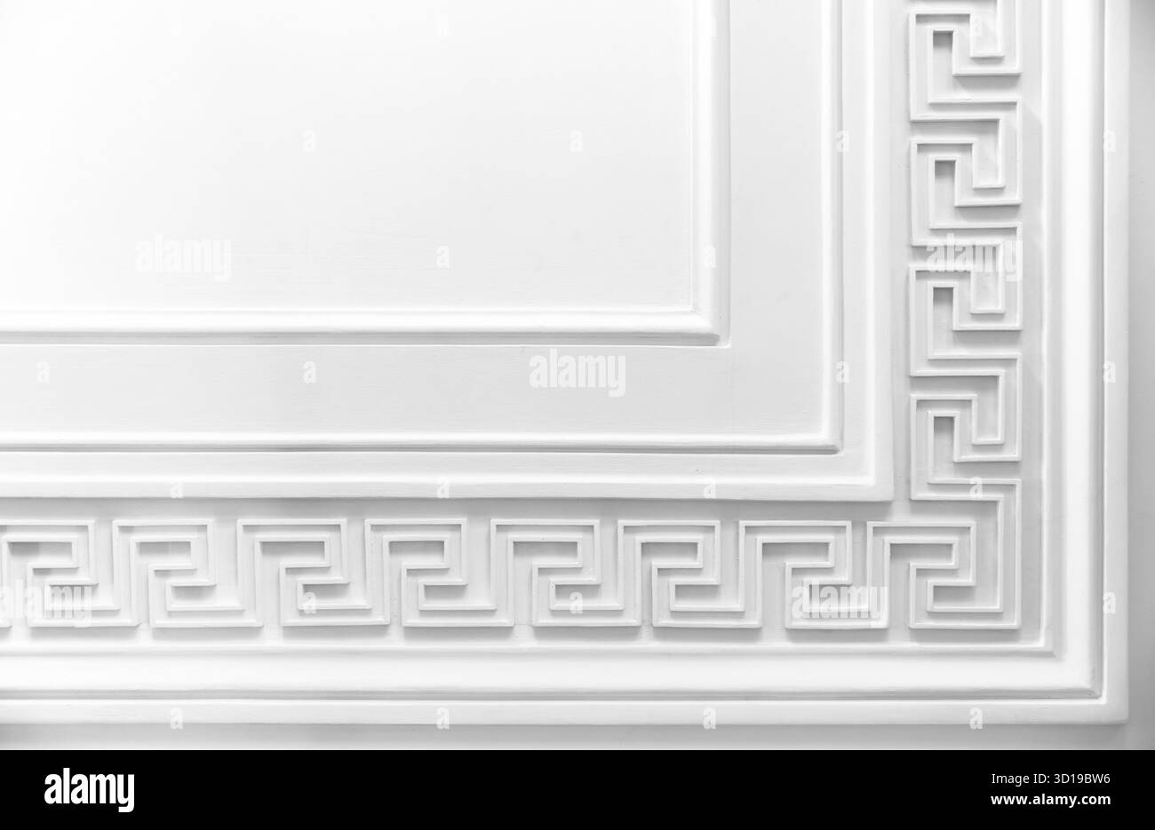 Meander motif over white wall backdrop. Classic moulding pattern ...