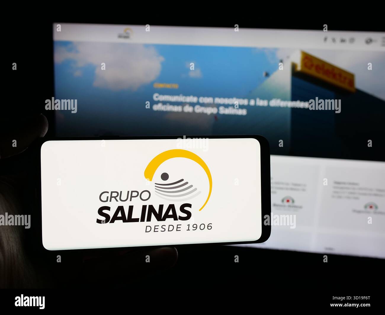 Stuttgart, Germany - 10-20-2025: Person holding smartphone with logo of ...