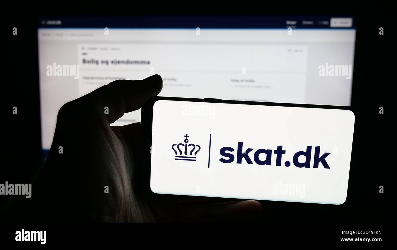Stuttgart, Germany - 10-20-2025: Person holding mobile phone with logo ...
