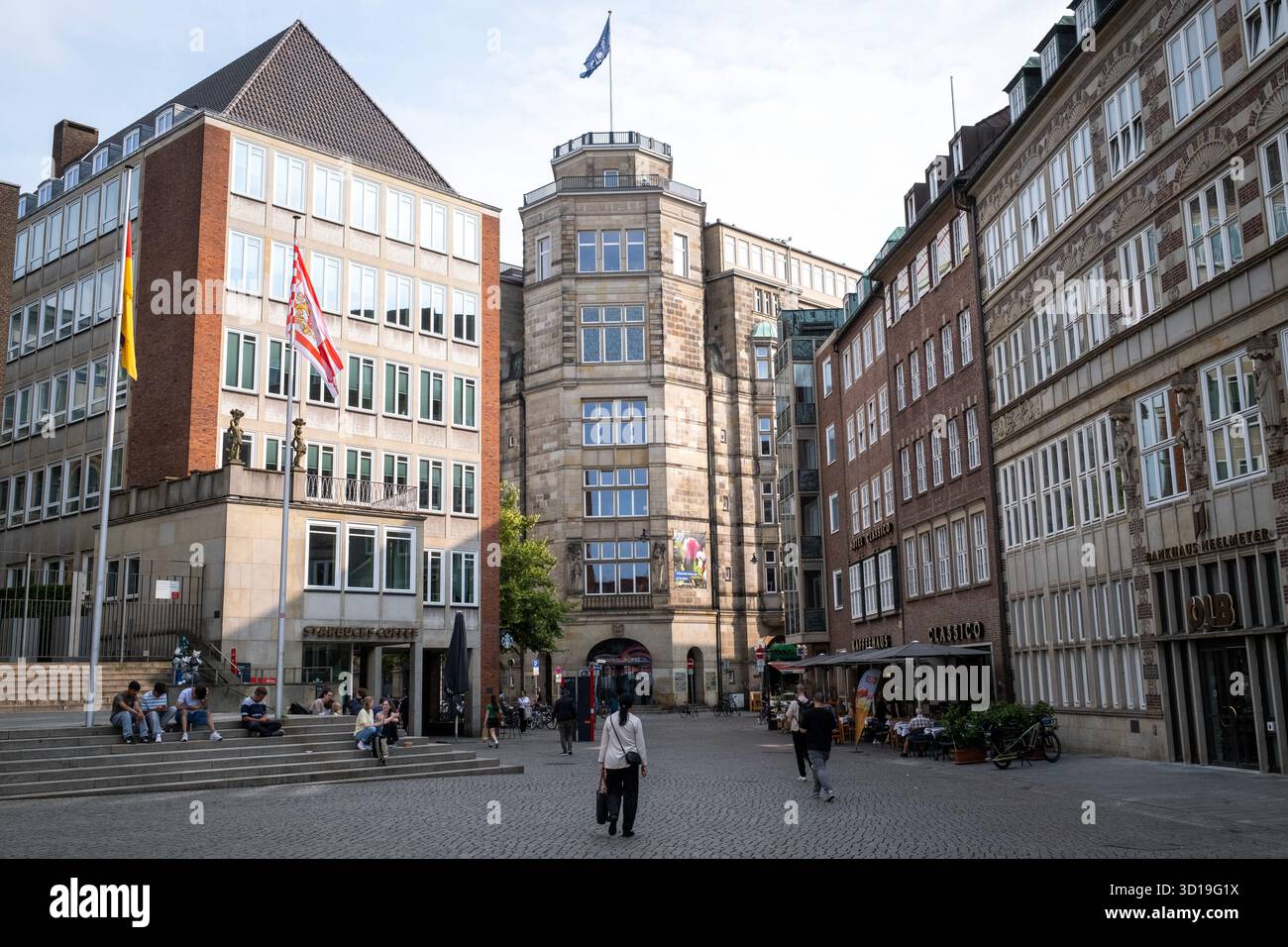 View of Market Square in Bremen with people walking and sitting in ...