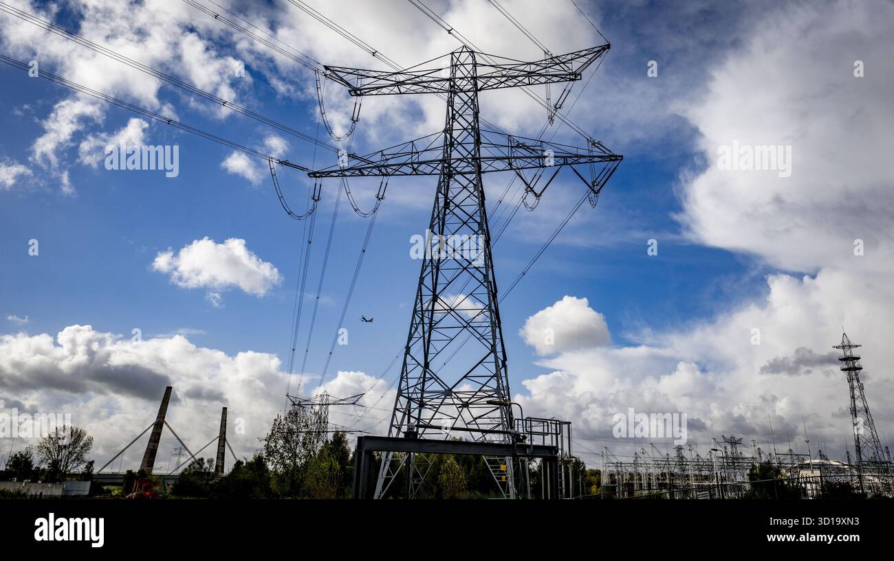 DIEMEN - A Tennet power station. High-voltage pylons dot the landscape ...