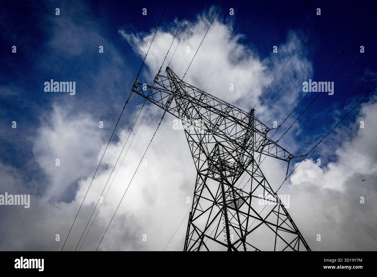 DIEMEN - A Tennet power station. High-voltage pylons dot the landscape ...