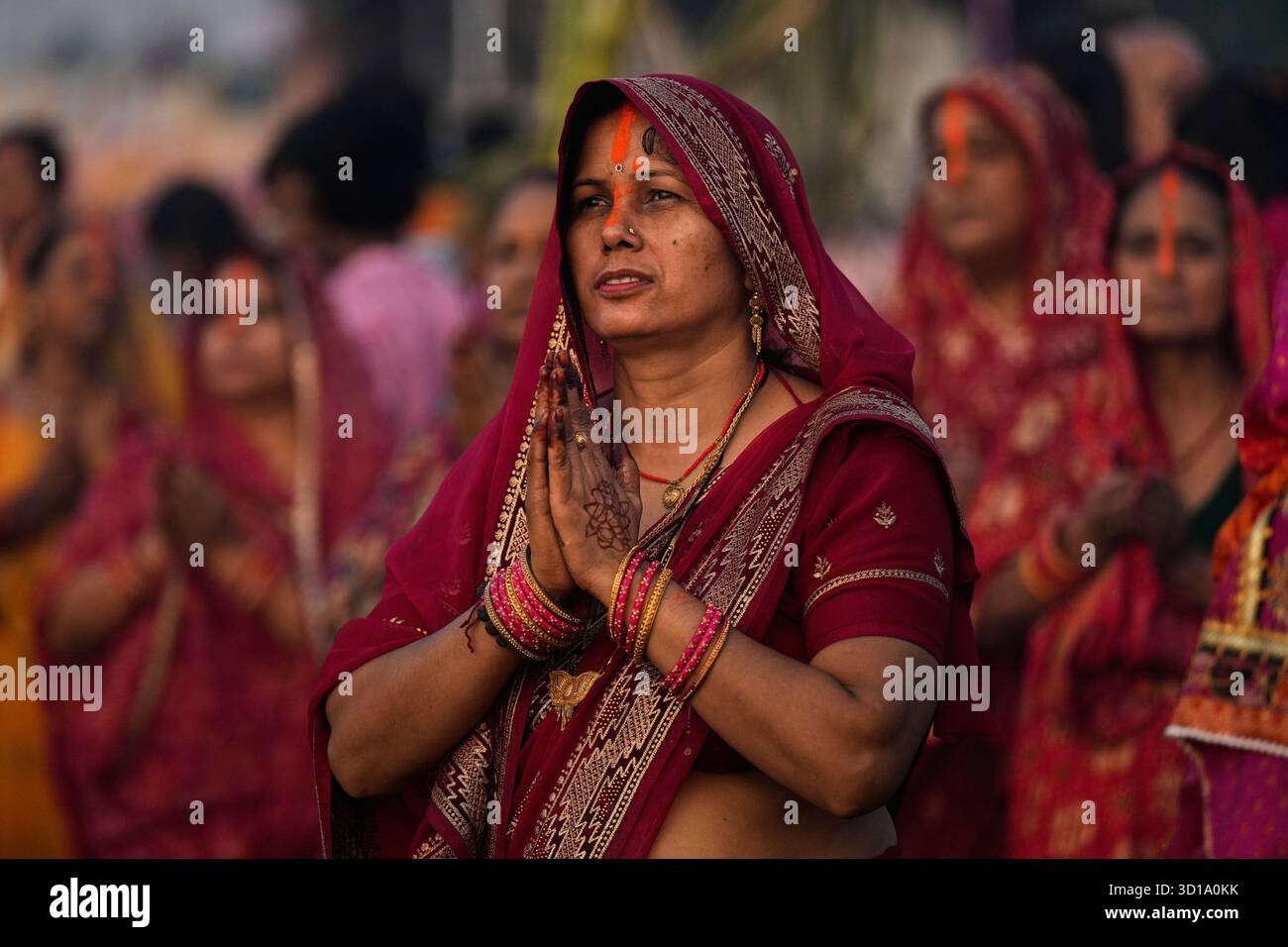 Indian Hindu devotees perform rituals in the the river Brahmaputra ...