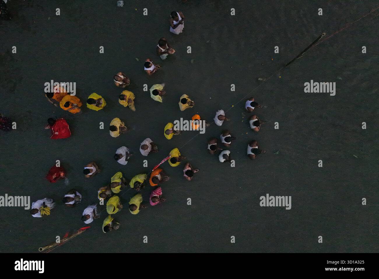 Indian Hindu devotees perform rituals in the the river Brahmaputra ...
