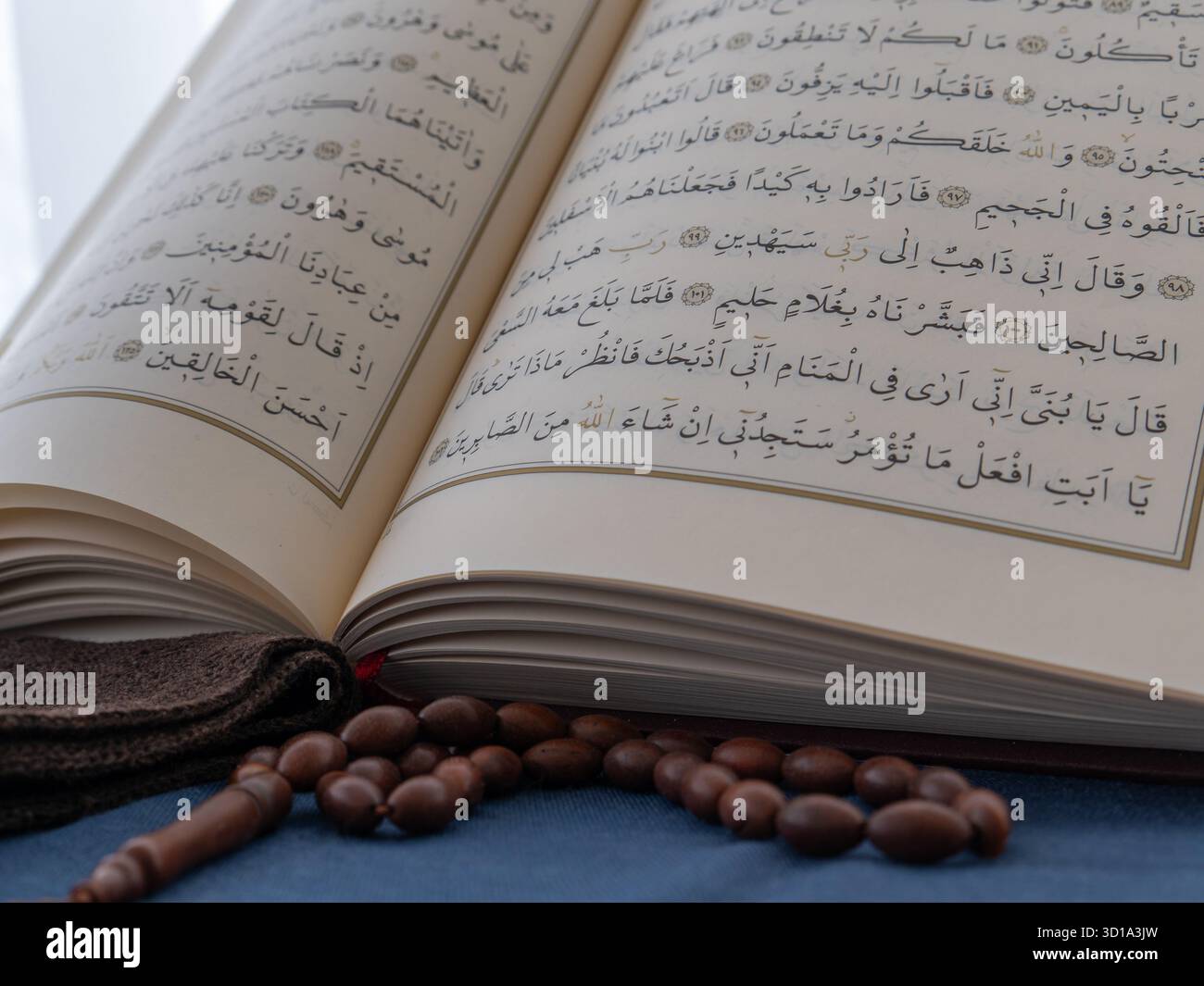 The pages of the Holy Quran are open. The concept of the Quran and ...