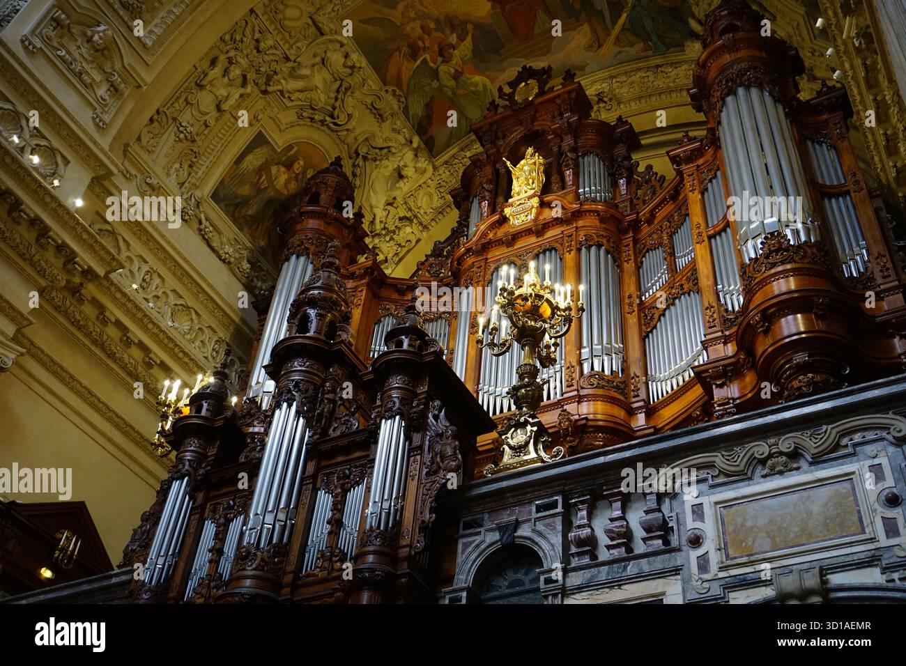 Detailed side view close up of the ornately decorated church organ ...