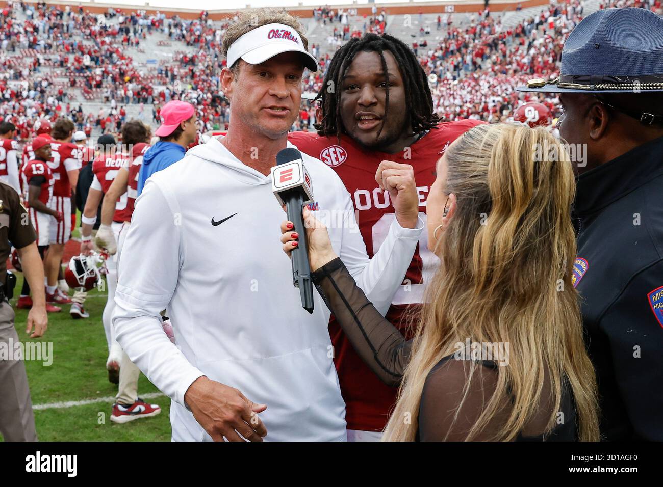 Mississippi head coach Lane Kiffin gestures towards Oklahoma defensive lineman David Stone (0 ...
