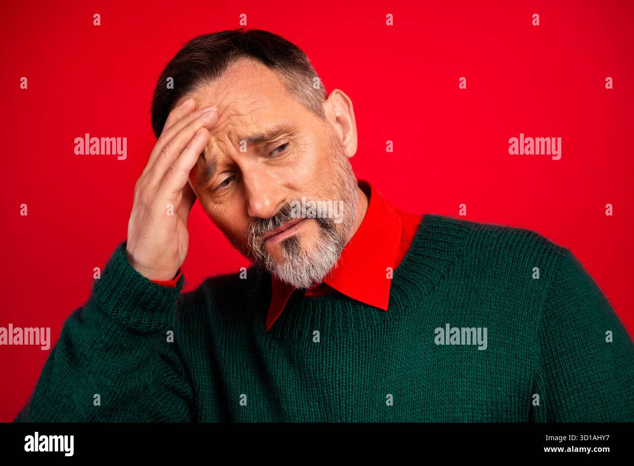 A jolly man in a green Christmas sweater battles holiday stress under a ...
