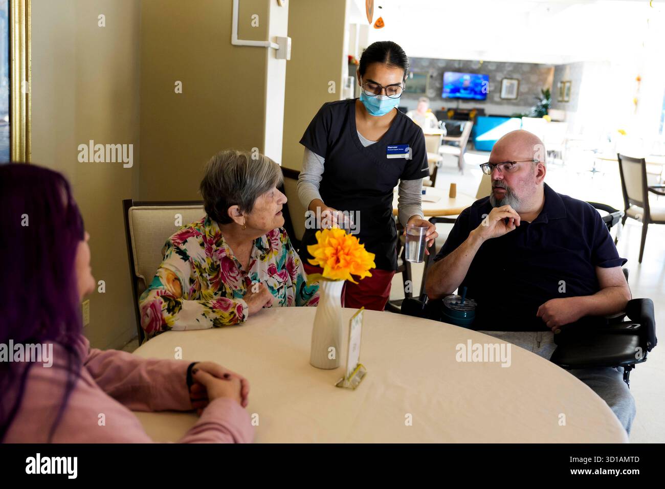 Personal support worker Harveer Sidhu brings drinks for residents Wendi ...