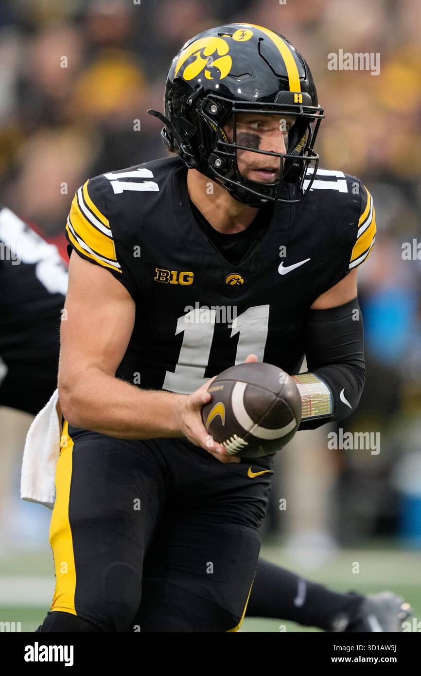 Iowa quarterback Mark Gronowski looks to hand the ball off during the ...