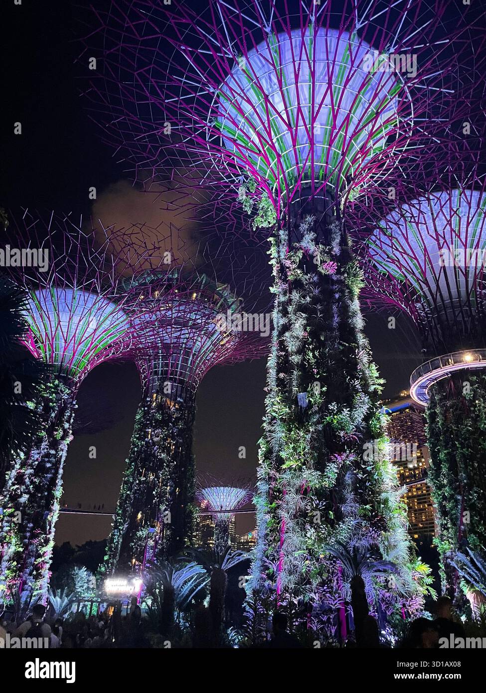 Futuristic vertical gardens known as Supertrees at Gardens by the Bay ...