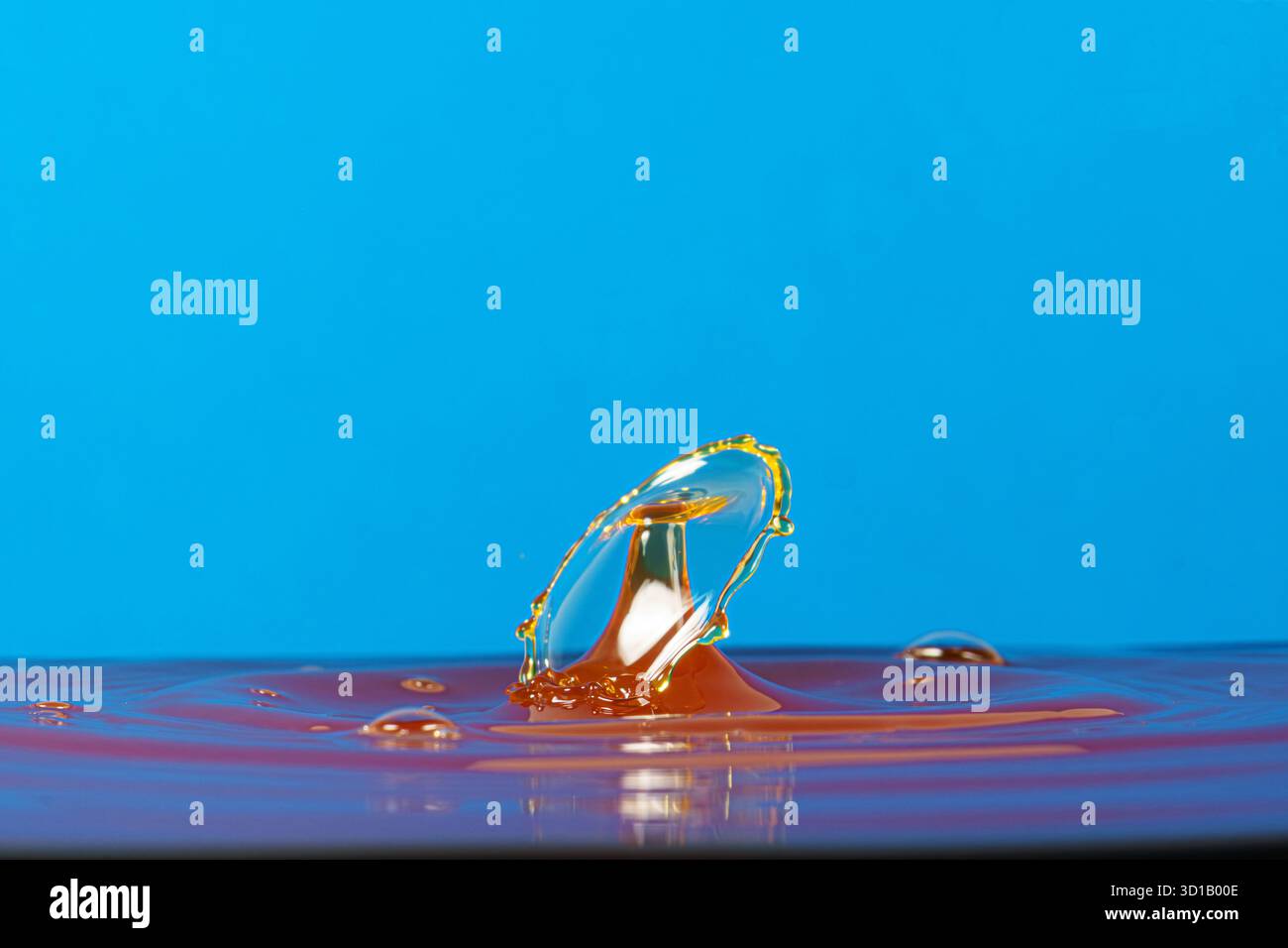 Amber Droplet Crown on Impact Stock Photo - Alamy