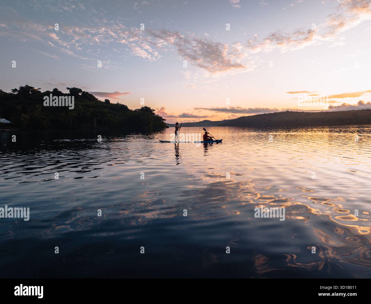 Aerial view of two people enjoying the calm waters between Moso Island ...