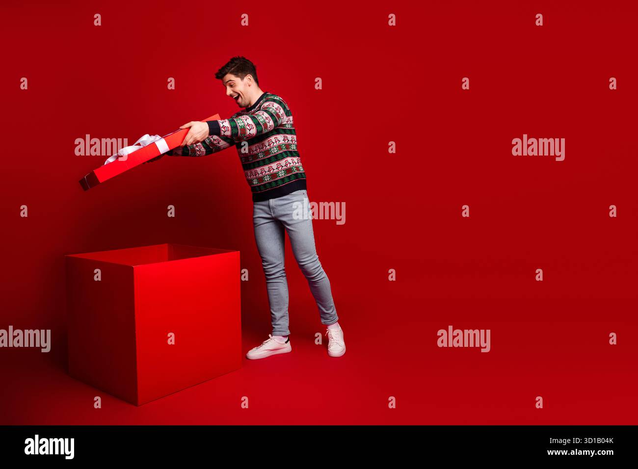 Funny man finds giant Christmas gift opens red box and laughs in ...