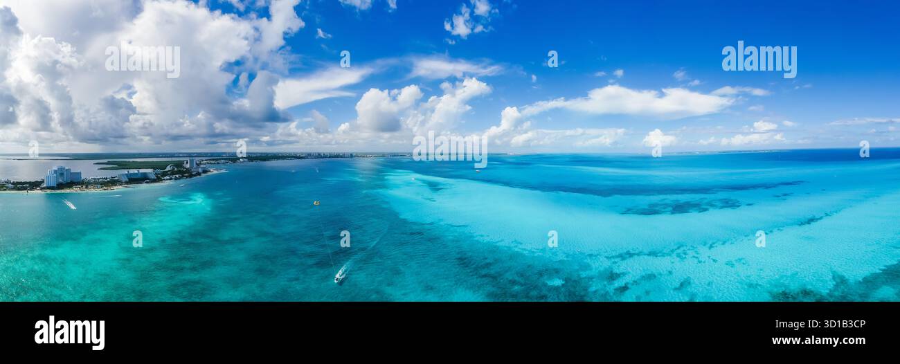 Aerial view of turquoise waters meet the white sands of Cancun's hotel ...