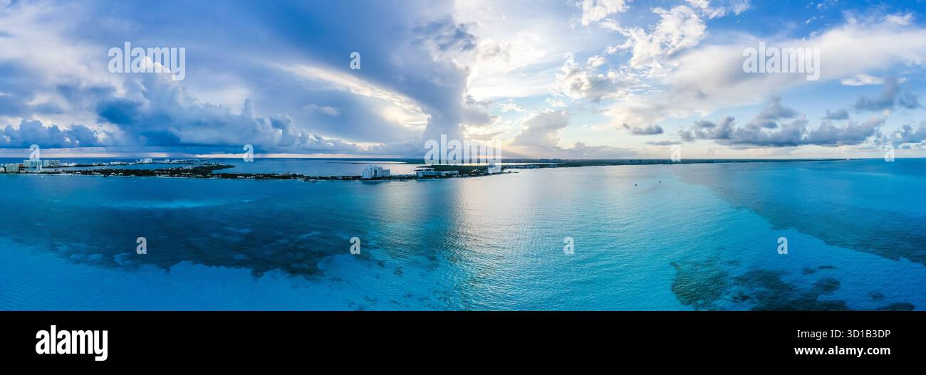 Aerial view of turquoise waters meet the hotel zone, a vibrant contrast ...