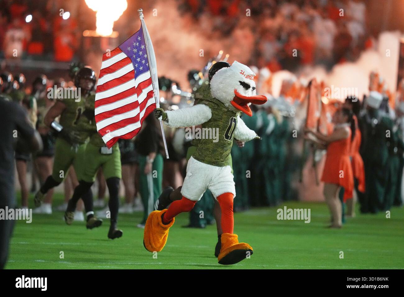 Miami mascot Sebastian the Ibis runs onto the field before an NCAA ...