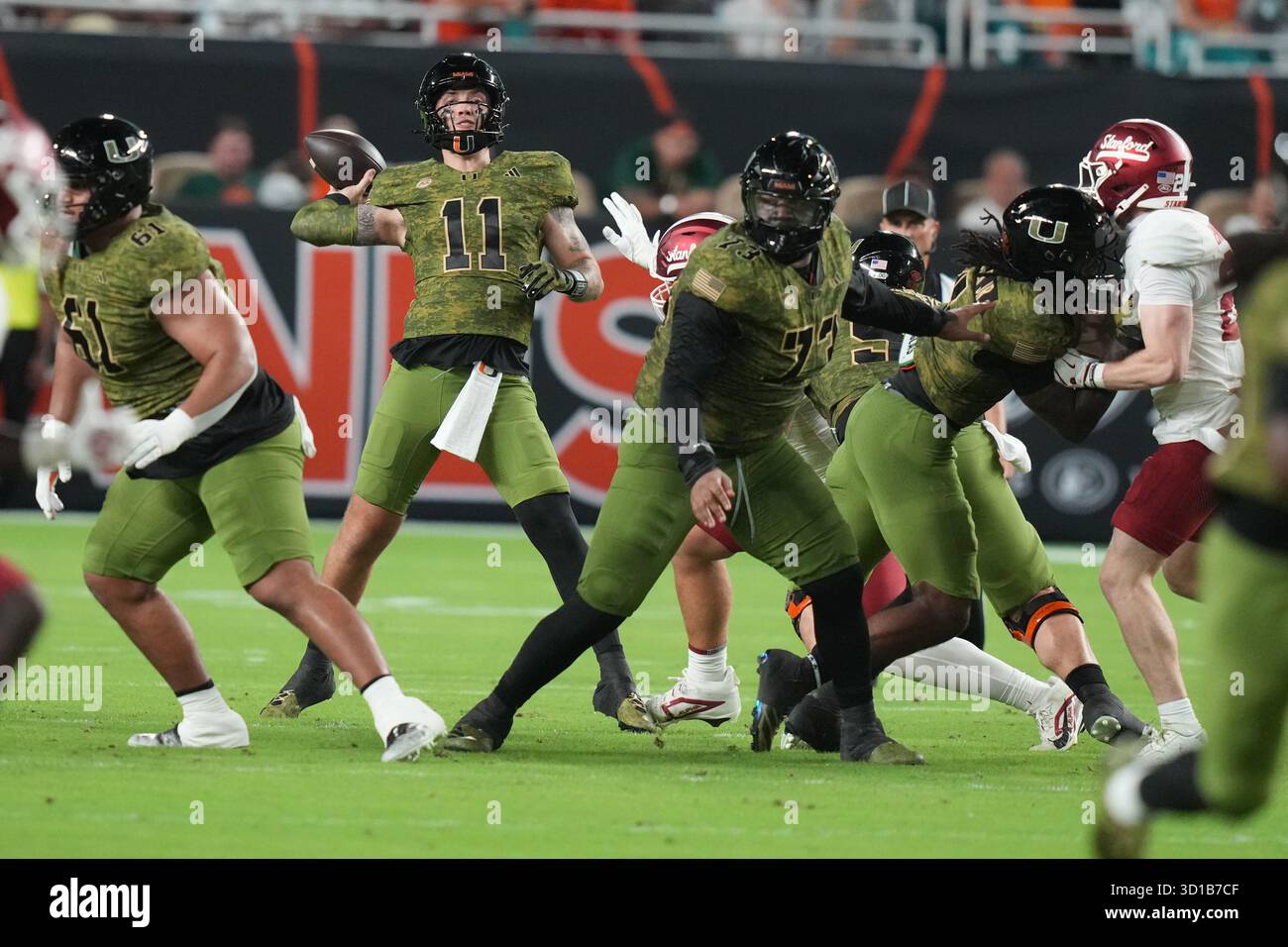 Miami quarterback Carson Beck (11) looks to pass during the first half ...