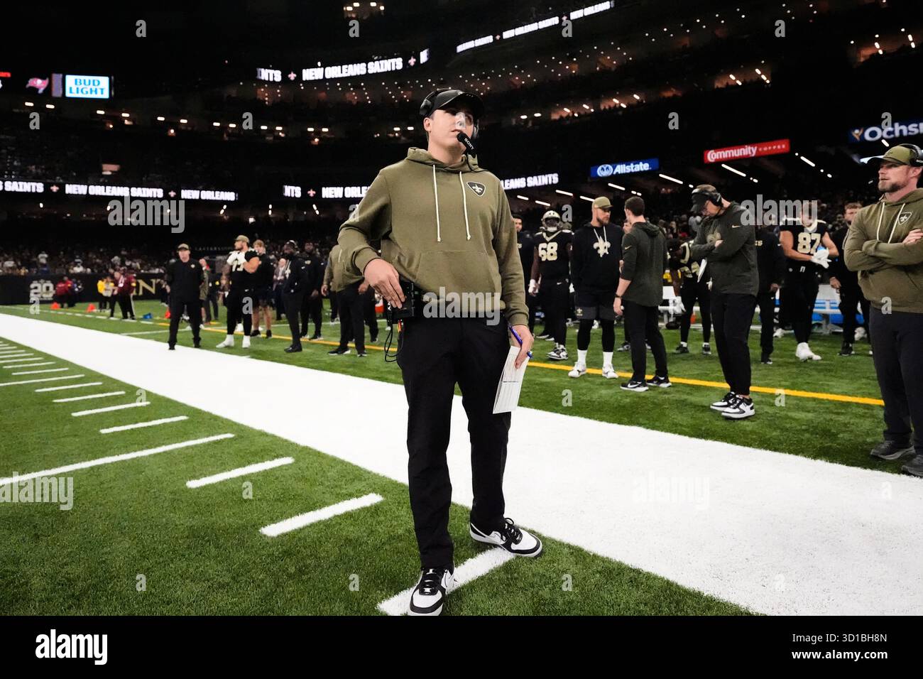 New Orleans Saints head coach Kellen Moore stands on the field before ...