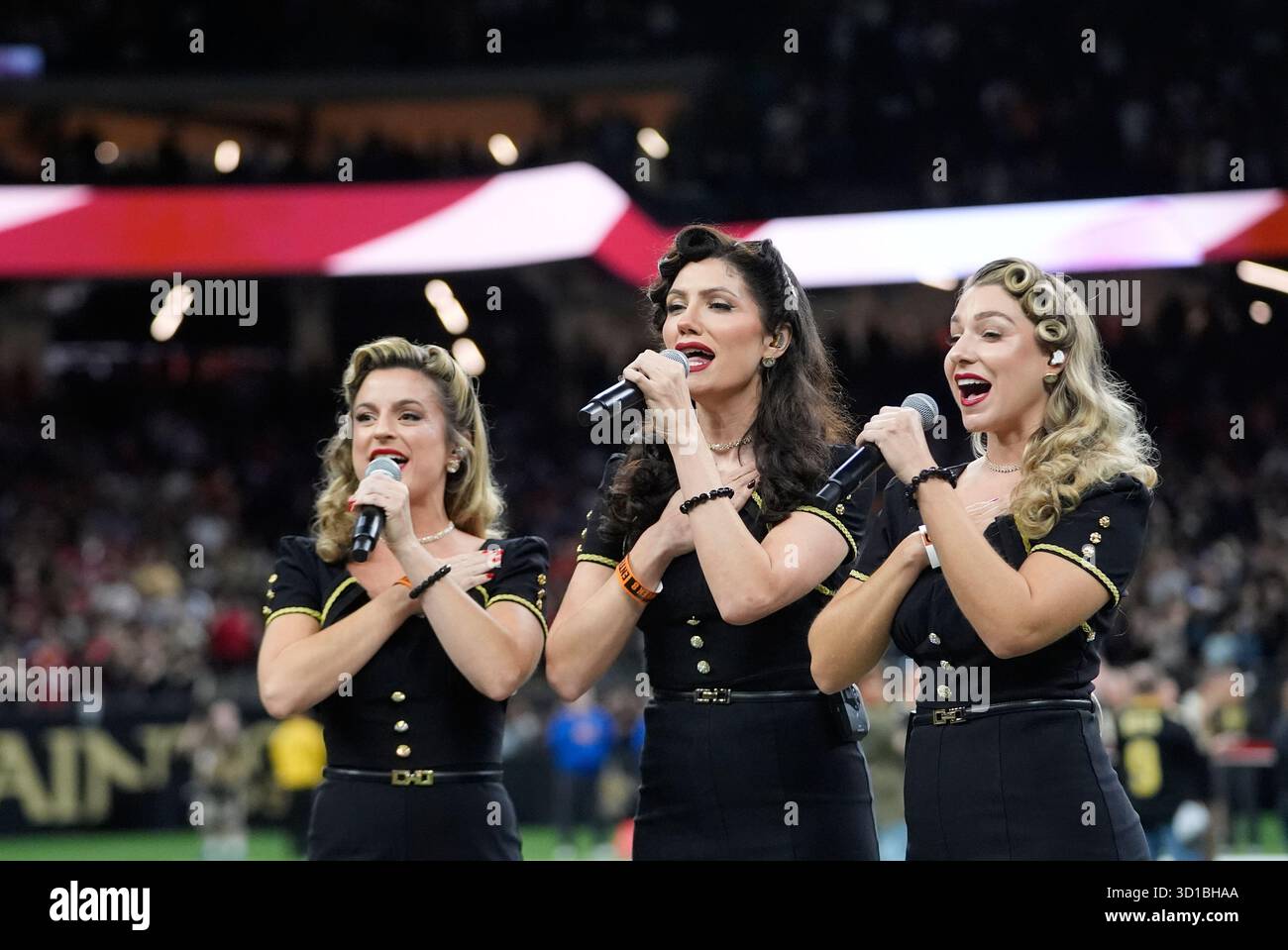 The Victory Belles sing the national anthem before an NFL football game ...