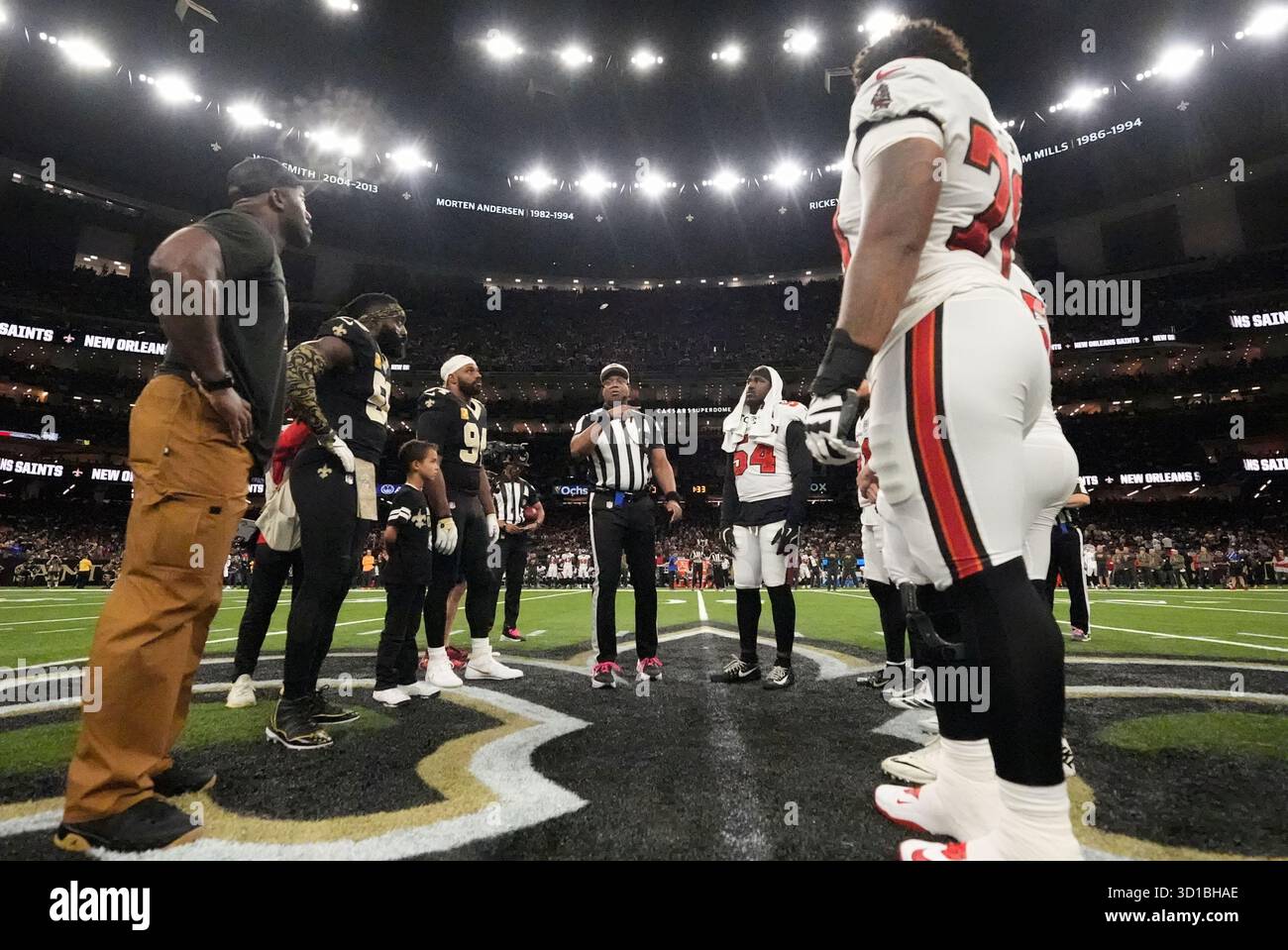 The head referee performs the coin toss before an NFL football game ...