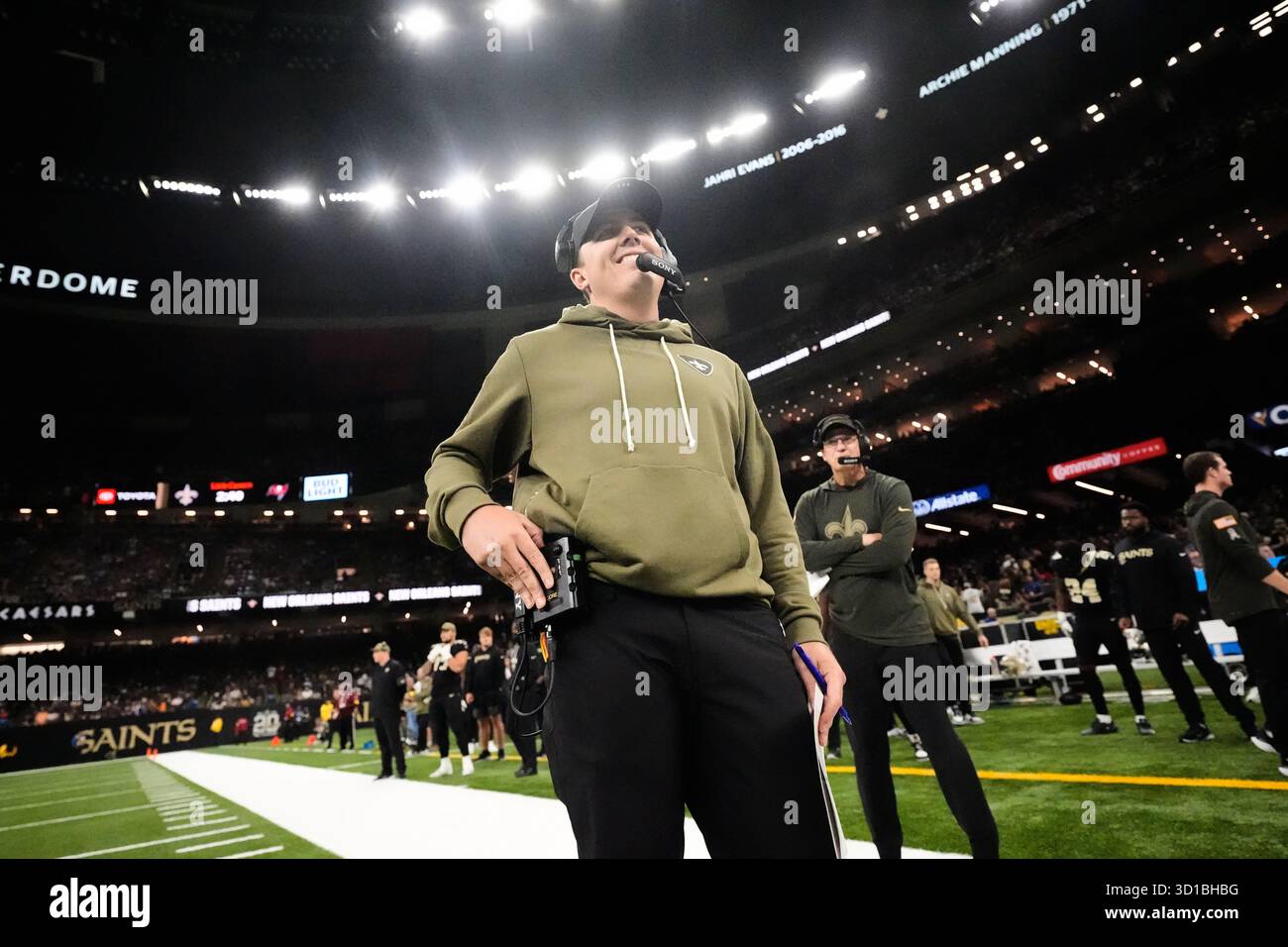 New Orleans Saints head coach Kellen Moore stands on the field before ...