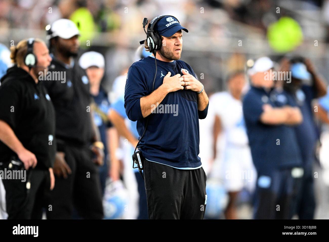 North Carolina defensive backs coach Brian Belichick, center, gives ...