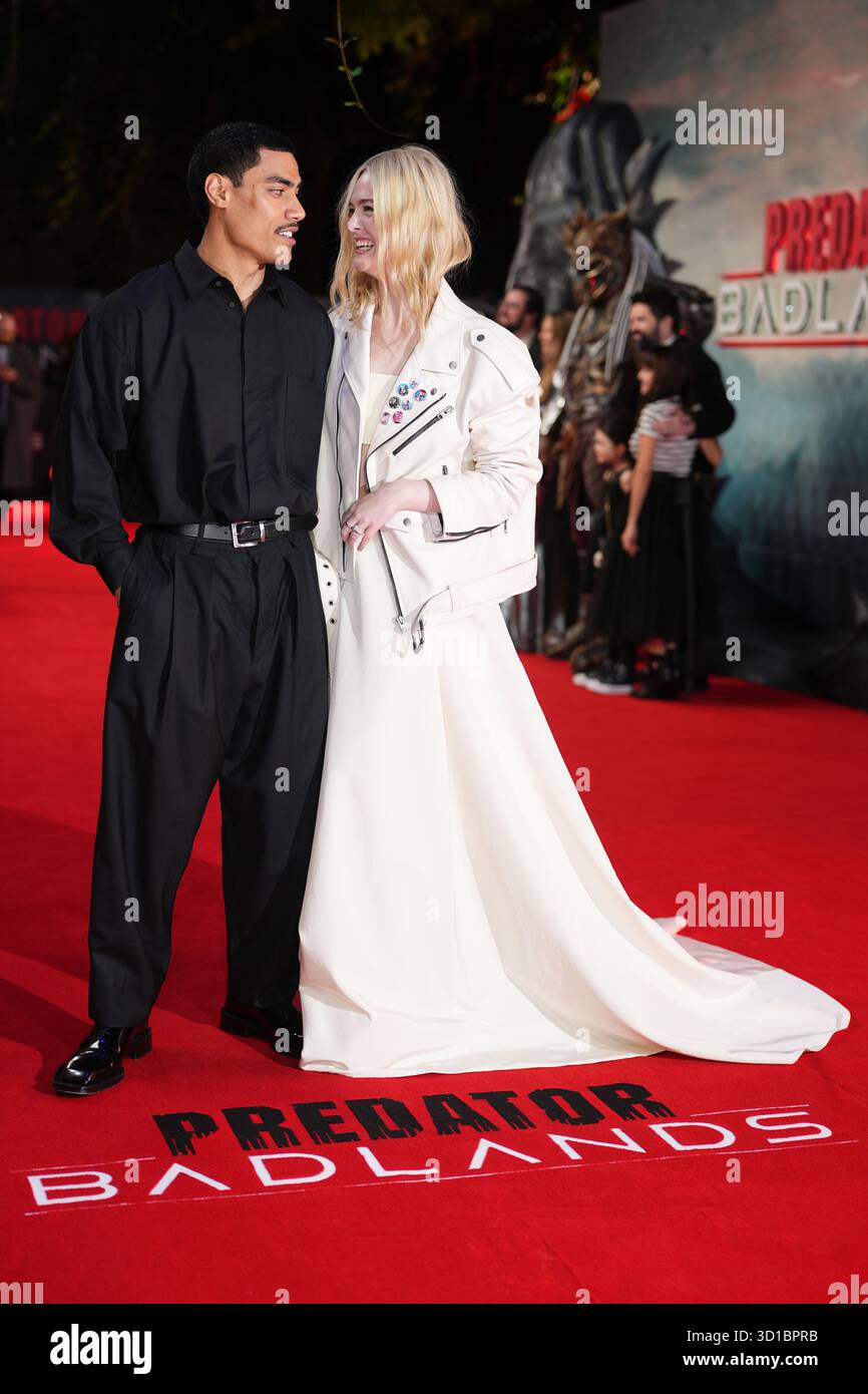 Dimitrius Koloamatangi, left, and Elle Fanning pose for photographers ...