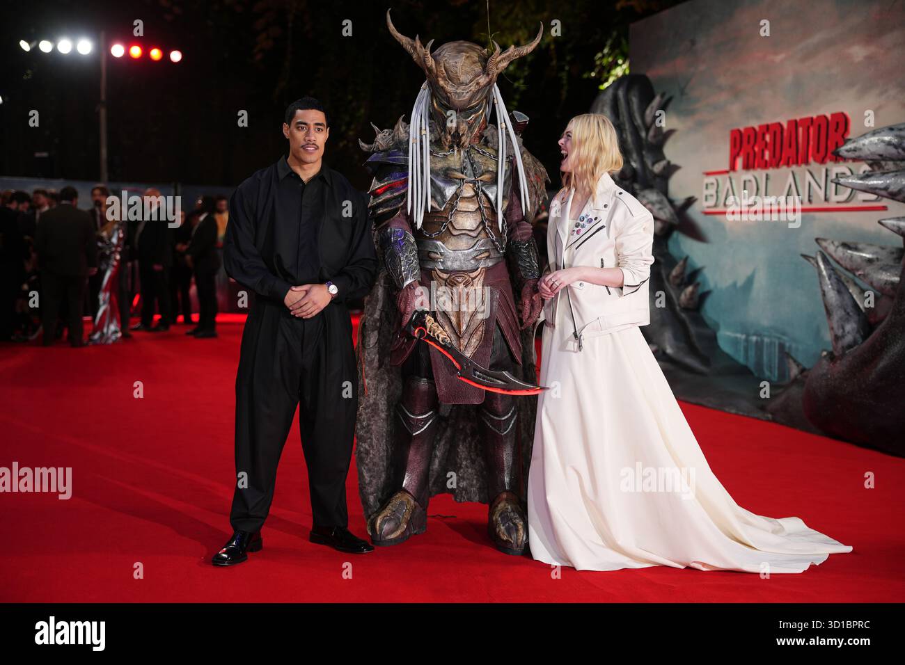 Dimitrius Koloamatangi, left, and Elle Fanning pose for photographers ...
