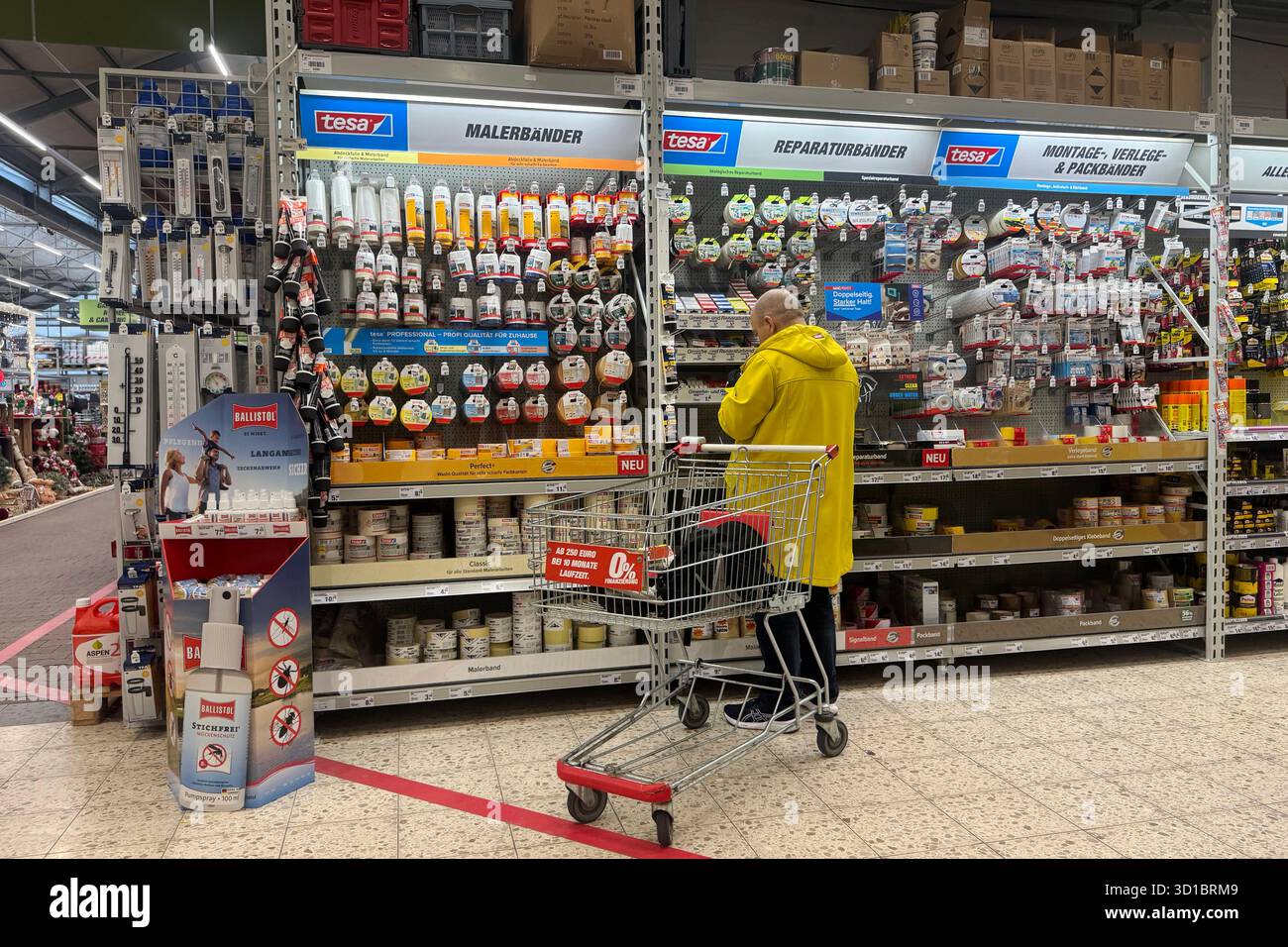 DIY chain toom, goods. Customer, man standing in front of shelves Stock ...