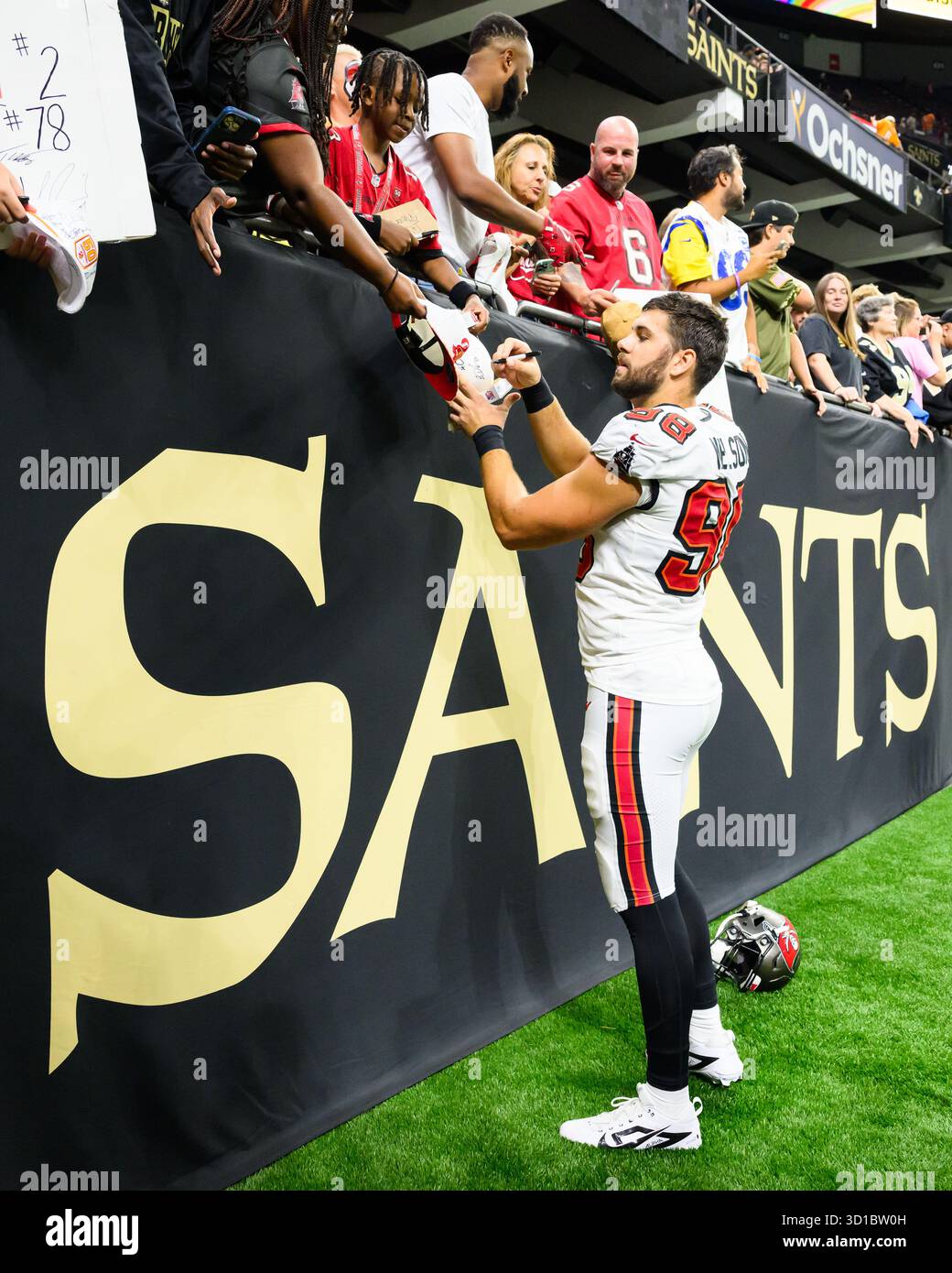 Tampa Bay Buccaneer outside linebacker Anthony Nelson (98) with fans ...