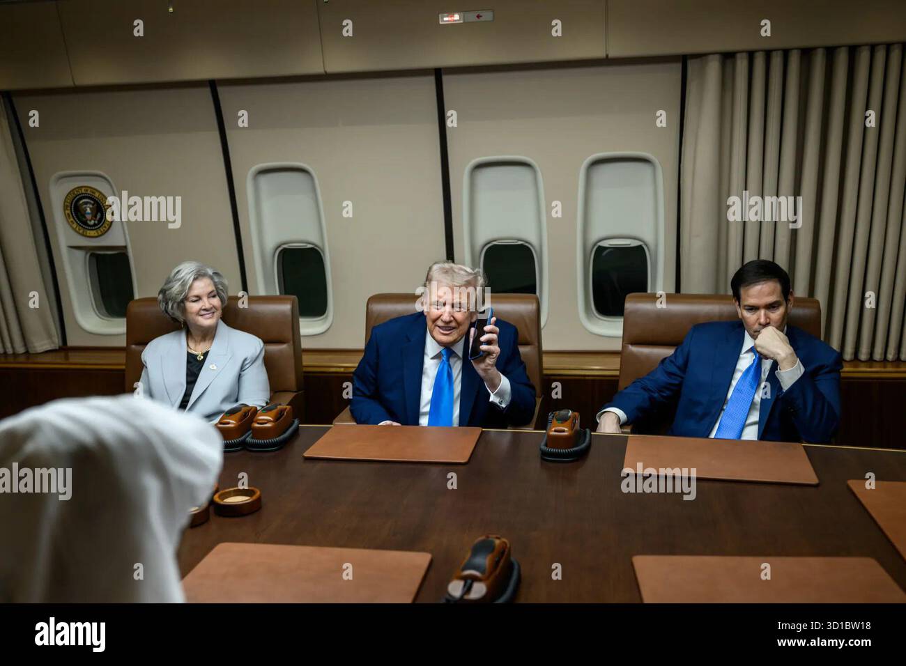 President Donald J. Trump speaks by phone aboard Air Force One with ...