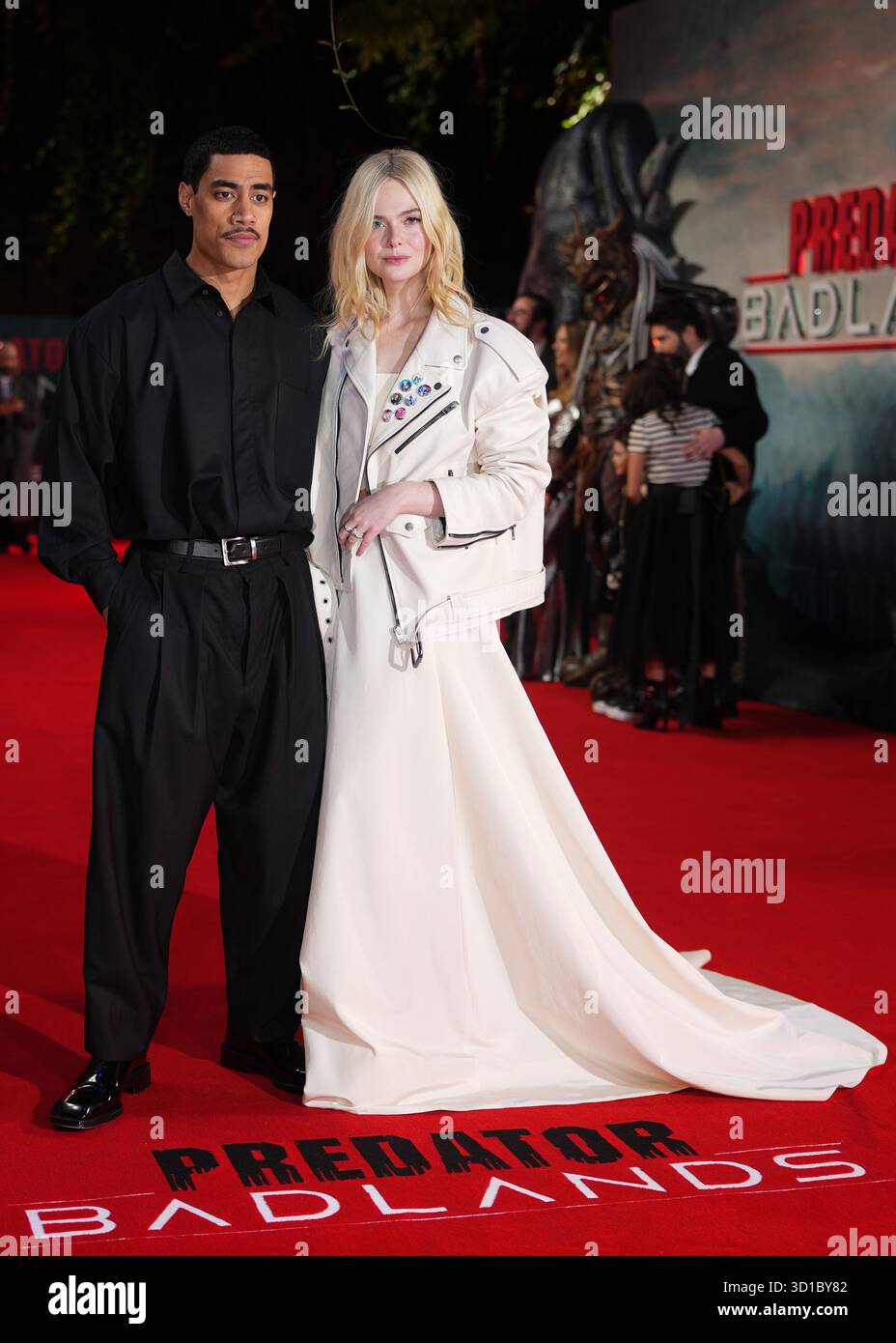 Dimitrius Koloamatangi, left, and Elle Fanning poses for photographers ...