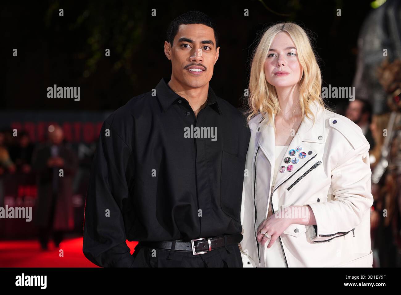 Dimitrius Koloamatangi, left, and Elle Fanning poses for photographers ...