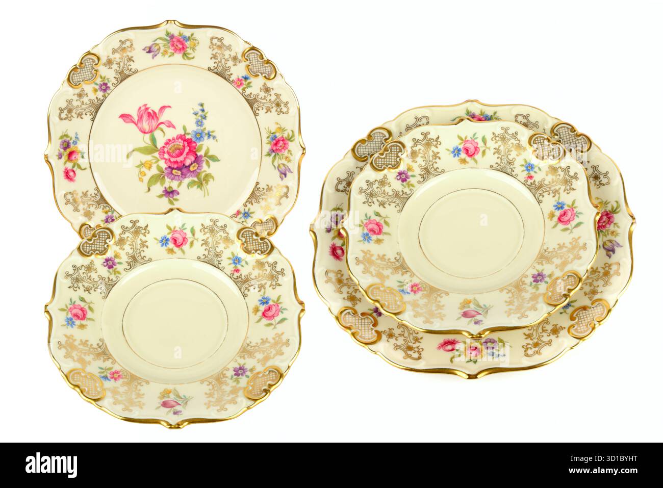 An ornate collection of vintage porcelain plates, featuring a detailed ...