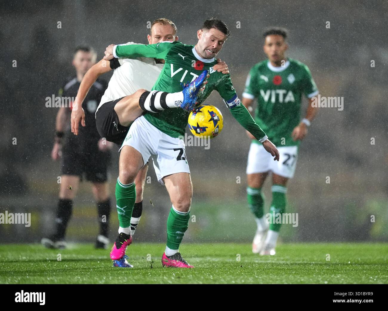 Port Vale's Ryan Croasdale and Stockport County's Oliver Norwood battle for the ball during the ...