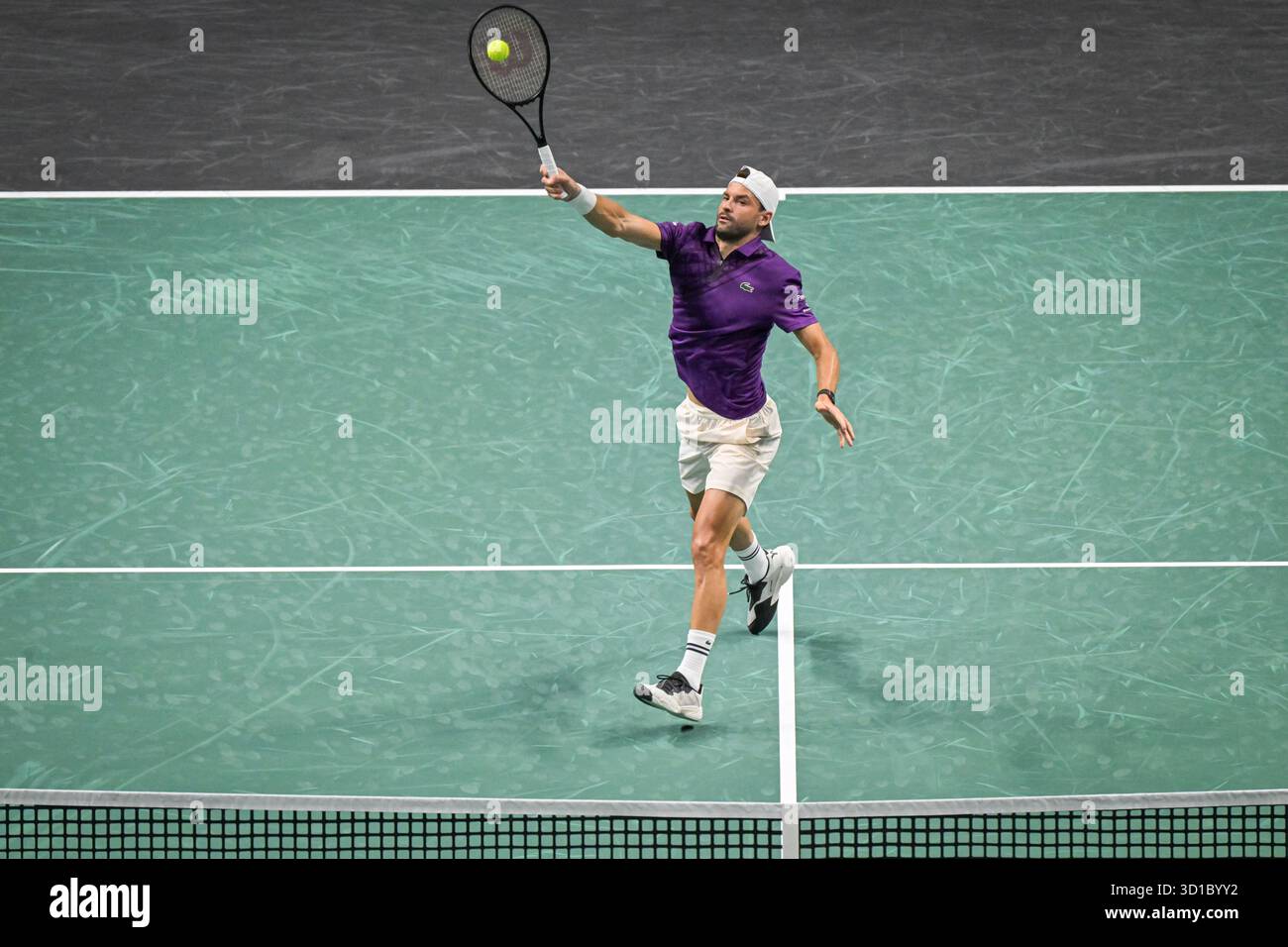 Giovanni Mpetshi Perricard and Grigor Dimitrov compete during the Rolex ...