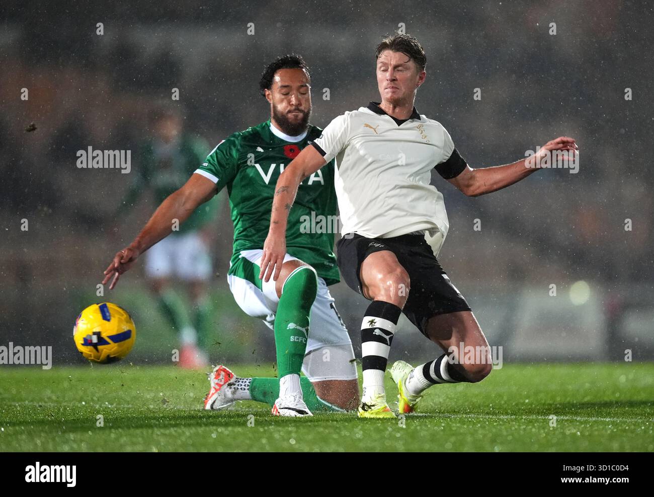 Stockport County's Kyle Wootton and Port Vale's George Byers during the ...