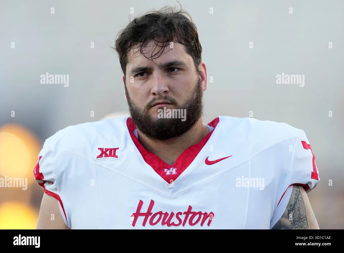 Houston offensive lineman Matthew Wykoff pauses on the field prior to ...