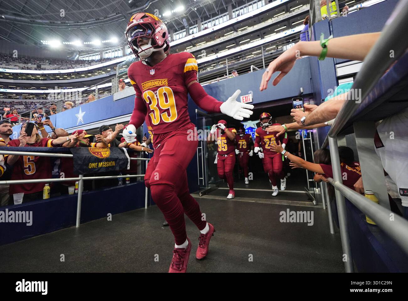 Washington Commanders safety Jeremy Reaves (39) jogs onto the field for ...