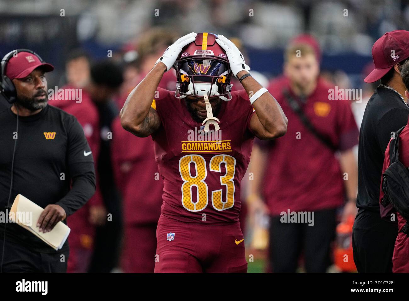 Washington Commanders wide receiver Jaylin Lane (83) puts his helmet on ...