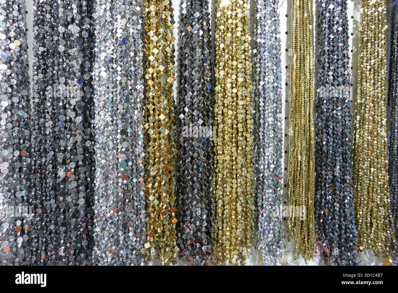 Long sparkling chains in gold, silver and platin colors. Symbols of ...