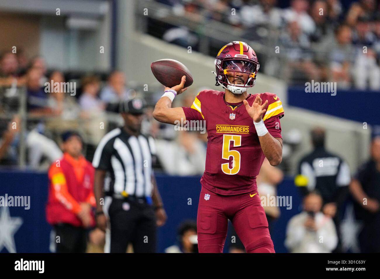 Washington Commanders quarterback Jayden Daniels throw a pass during an ...