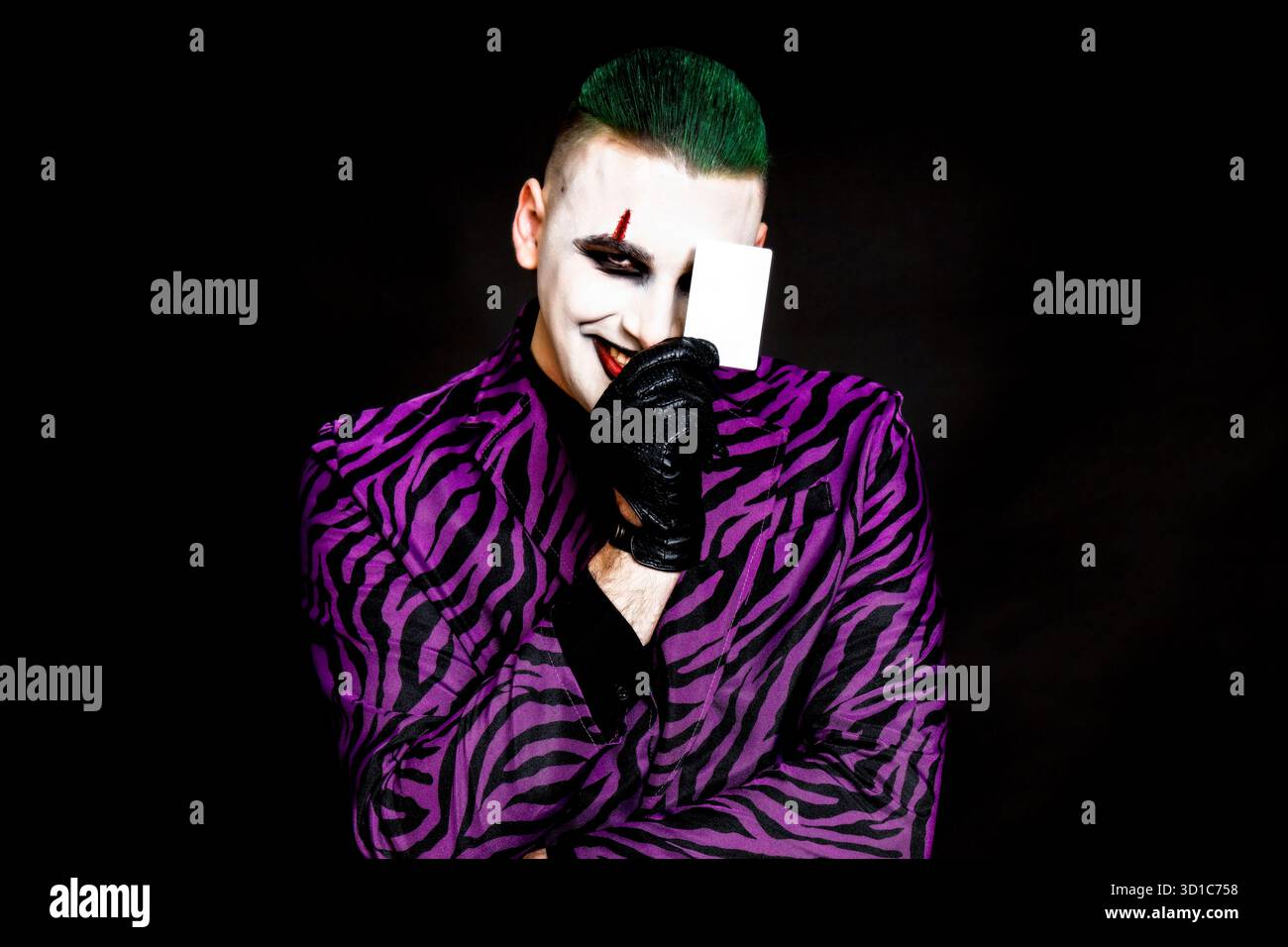 Scary clown is posing in studio on the isolated background. Halloween ...